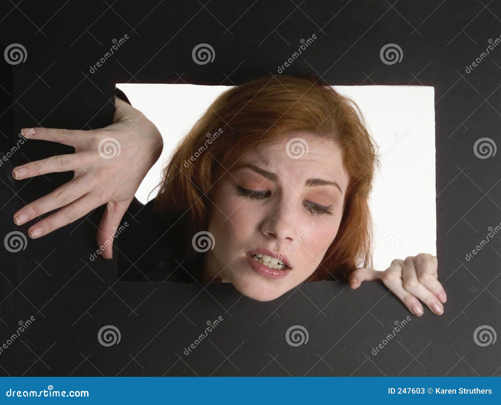 Redheaded Woman Climbing Out of a Black Box Stock Image - Image of ...