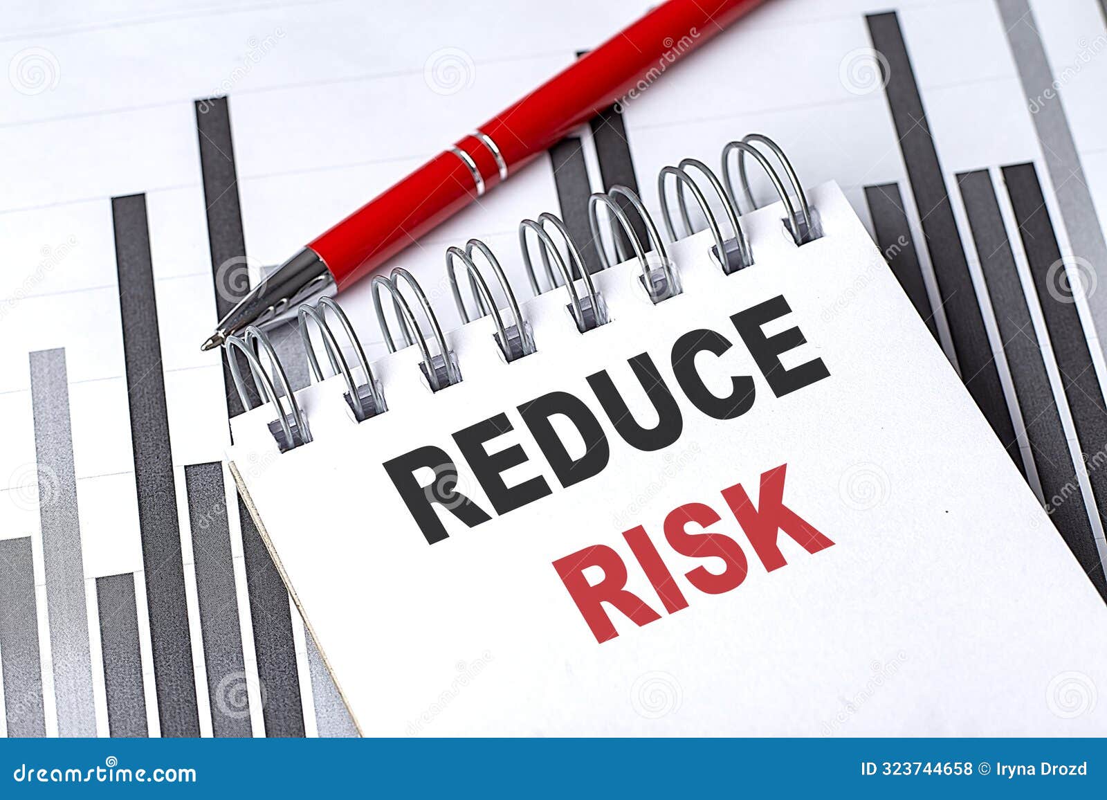 REDUCE RISK Text on Notebook on Chart with Pen Stock Photo - Image of ...