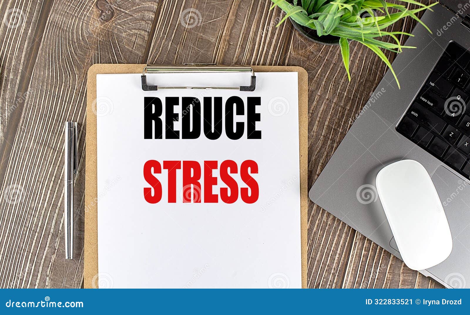 REDUCE STRESS Text on Clipboard Paper with Laptop, Mouse and Pen Stock ...