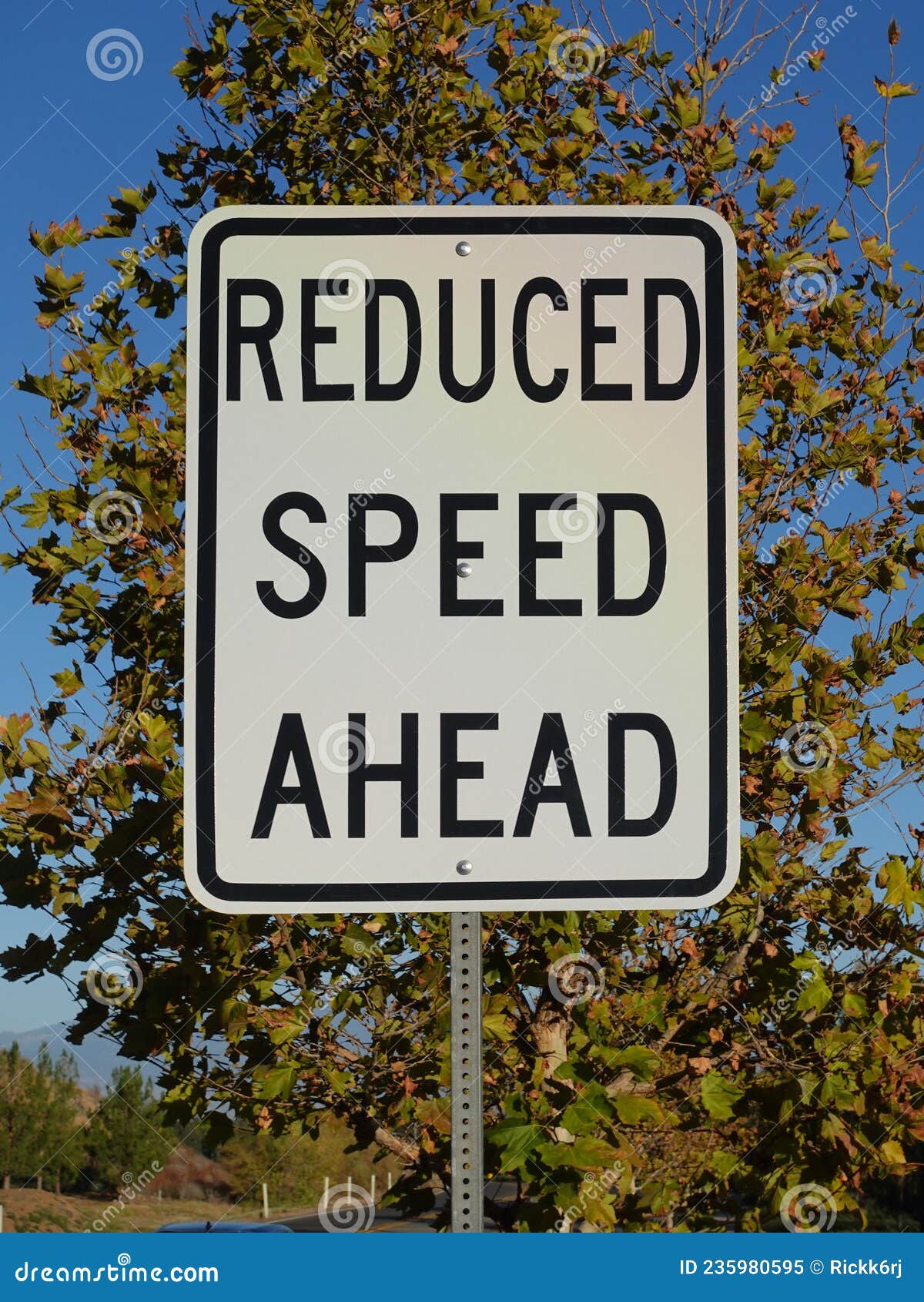 Reduced Speed Ahead Sign on Side of Road Stock Image - Image of ...