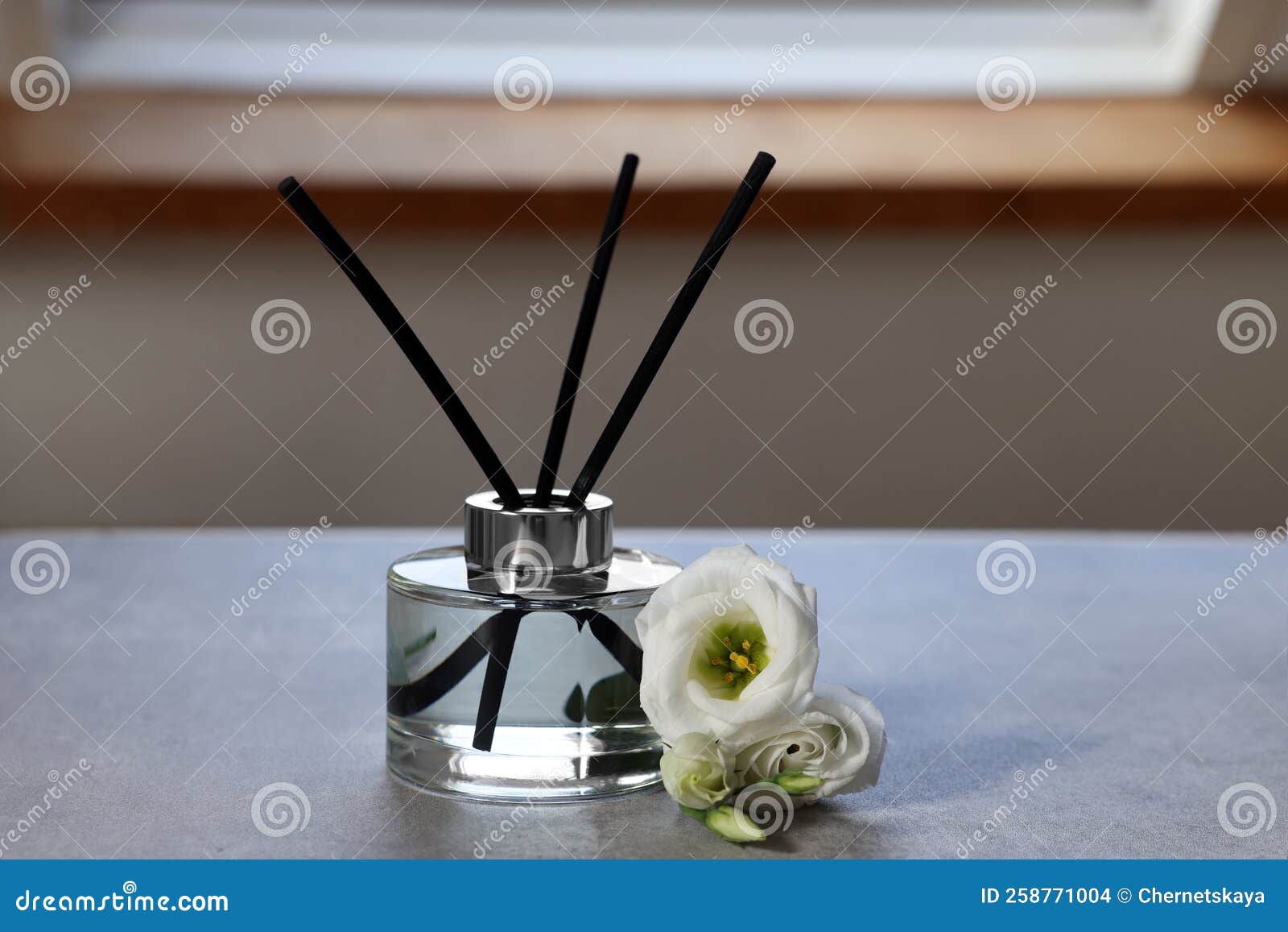 Reed Diffuser and Eustoma Flowers on Gray Marble Table Stock Photo ...