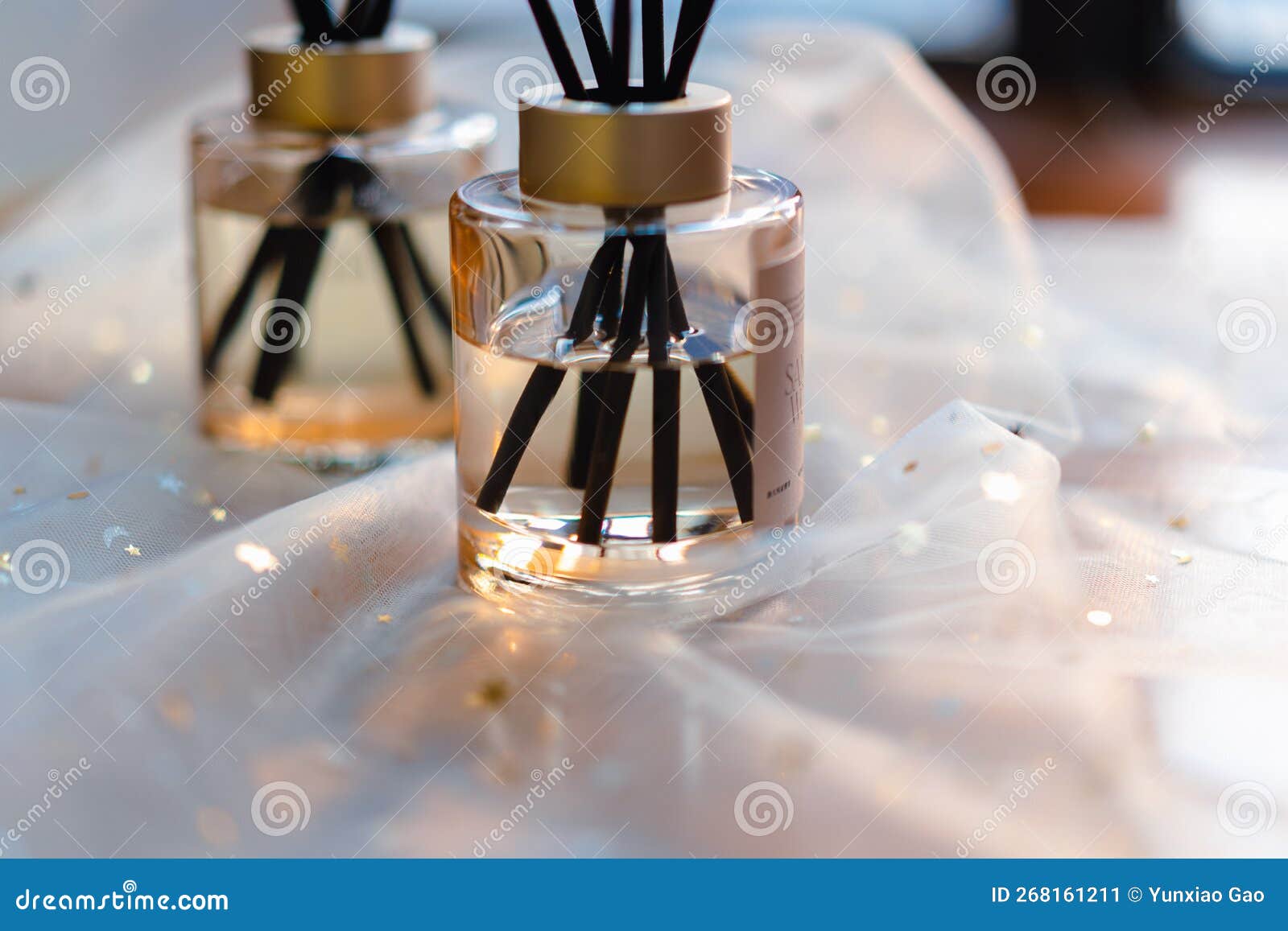 Reed Diffuser in Glass Bottle Placed on Beautiful Gauze Decorated with ...