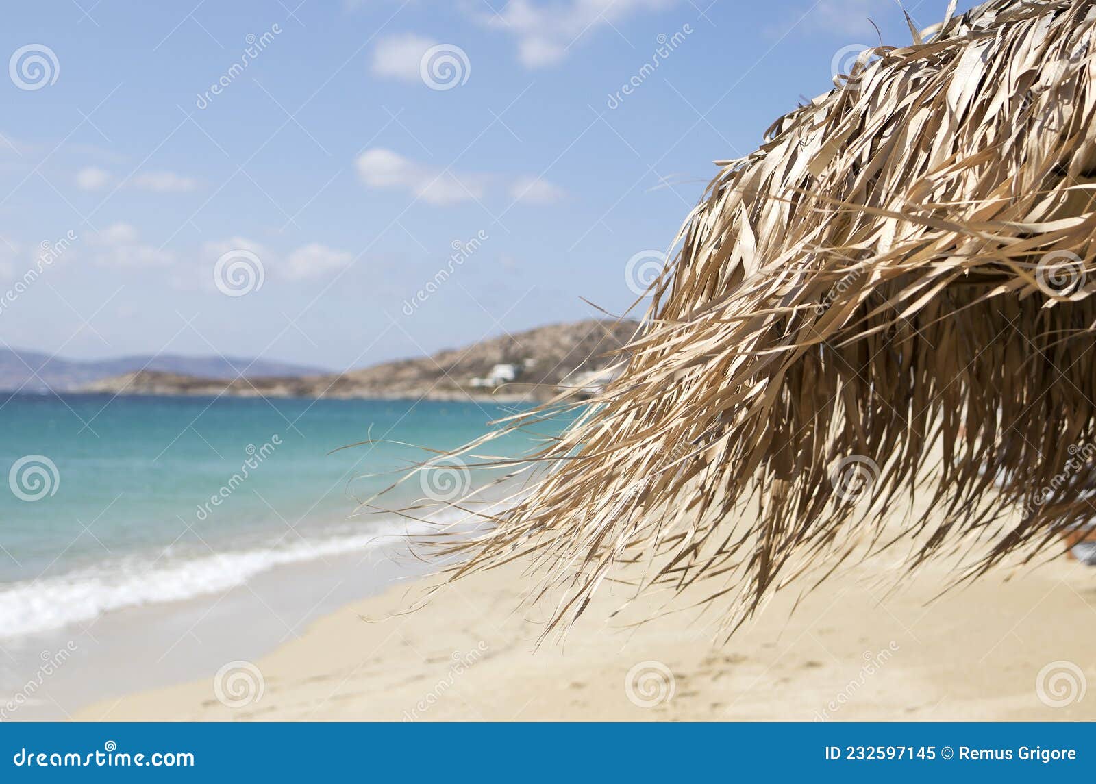 Reed umbrella on the beach stock image. Image of reed - 232597145
