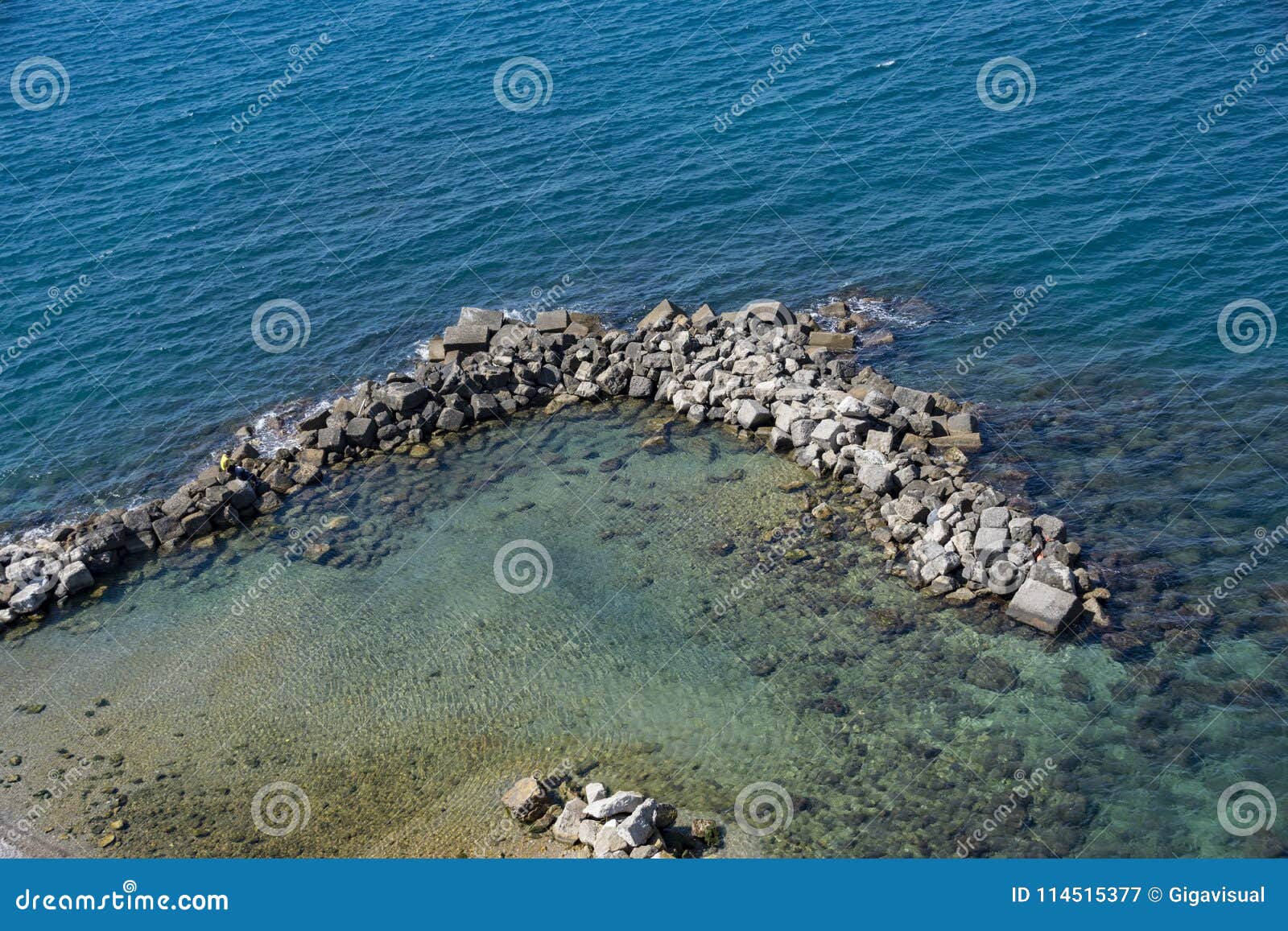 Reef breakwater at beach stock image. Image of ocean - 114515377