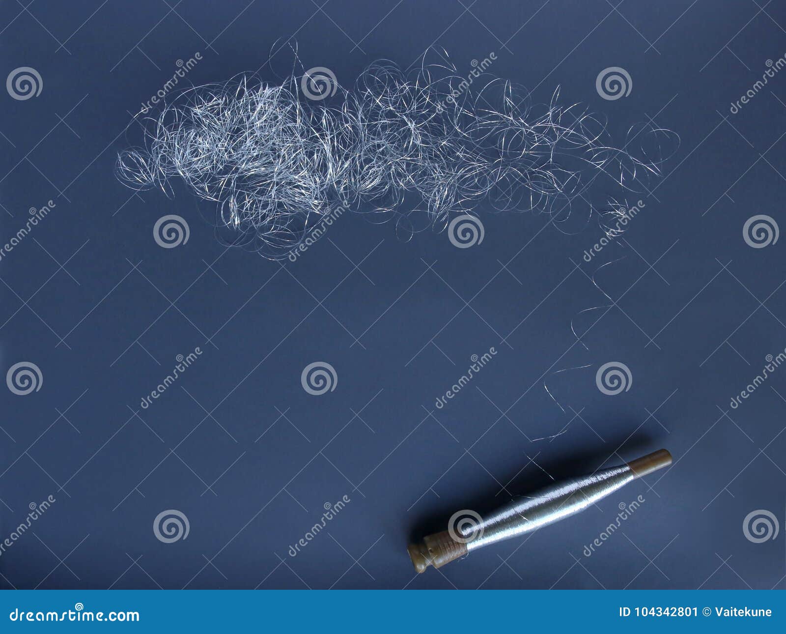 Silver Thread Pile Like Cloud and Spool of Silver Thread. Stock Image ...