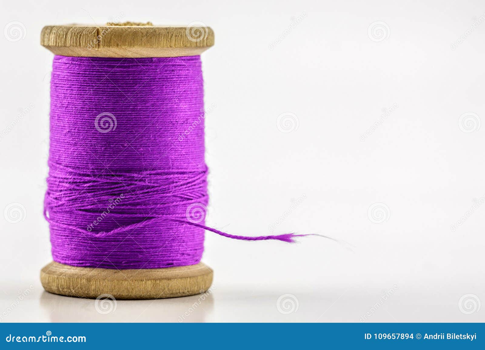 Reel or Spool of Violet Sewing Thread on White. Shallow Stock Photo ...