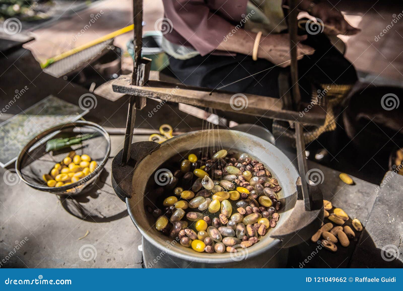 Reeling silk from cocoons stock photo. Image of production - 121049662