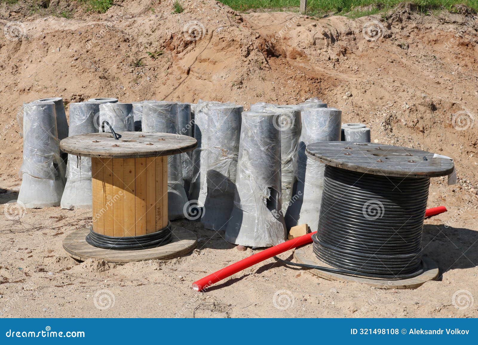Reels with Power Electrical Cable and Concrete Pillars on a ...