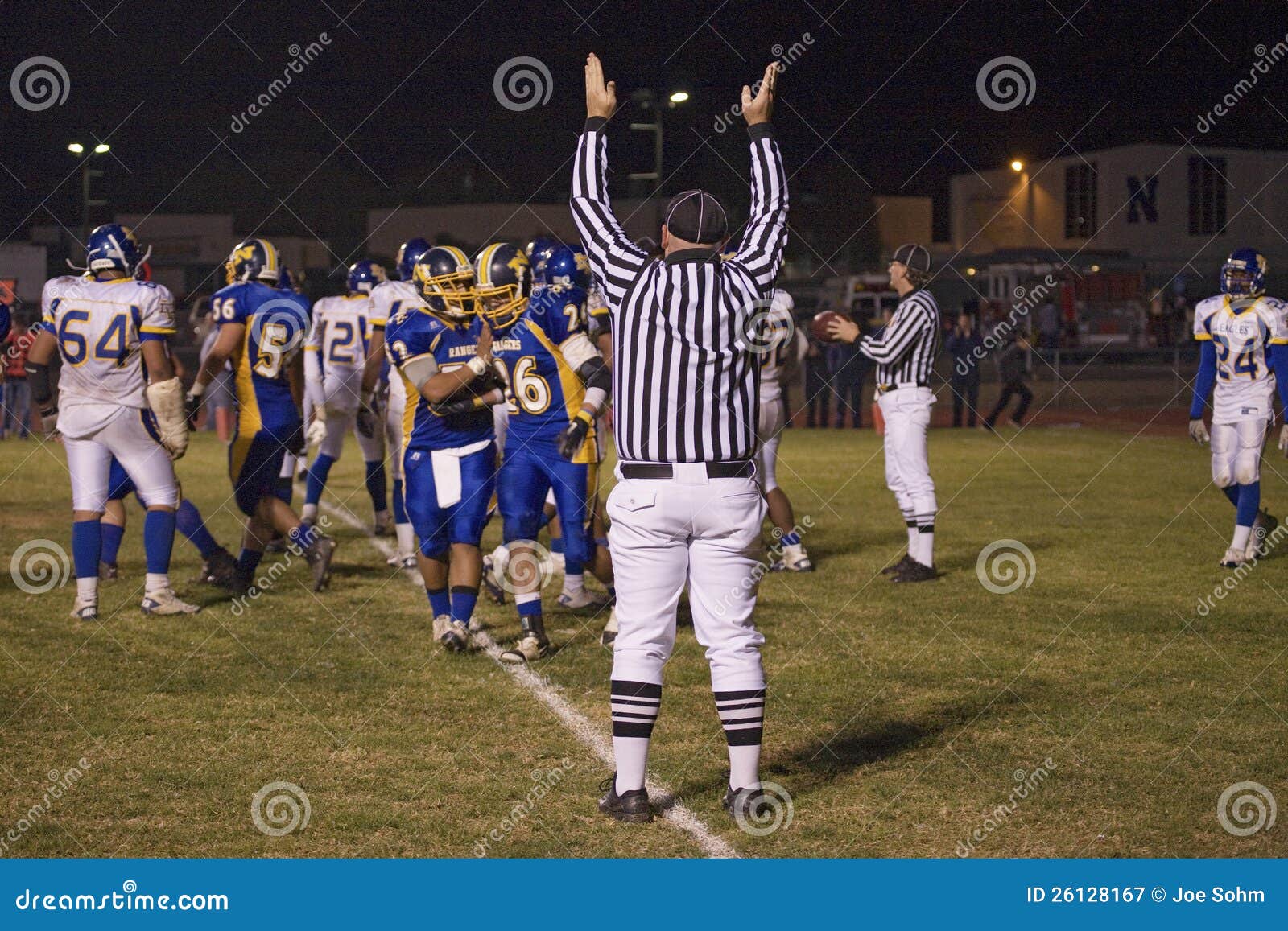 Referee calling touchdown editorial photography. Image of night - 26128167