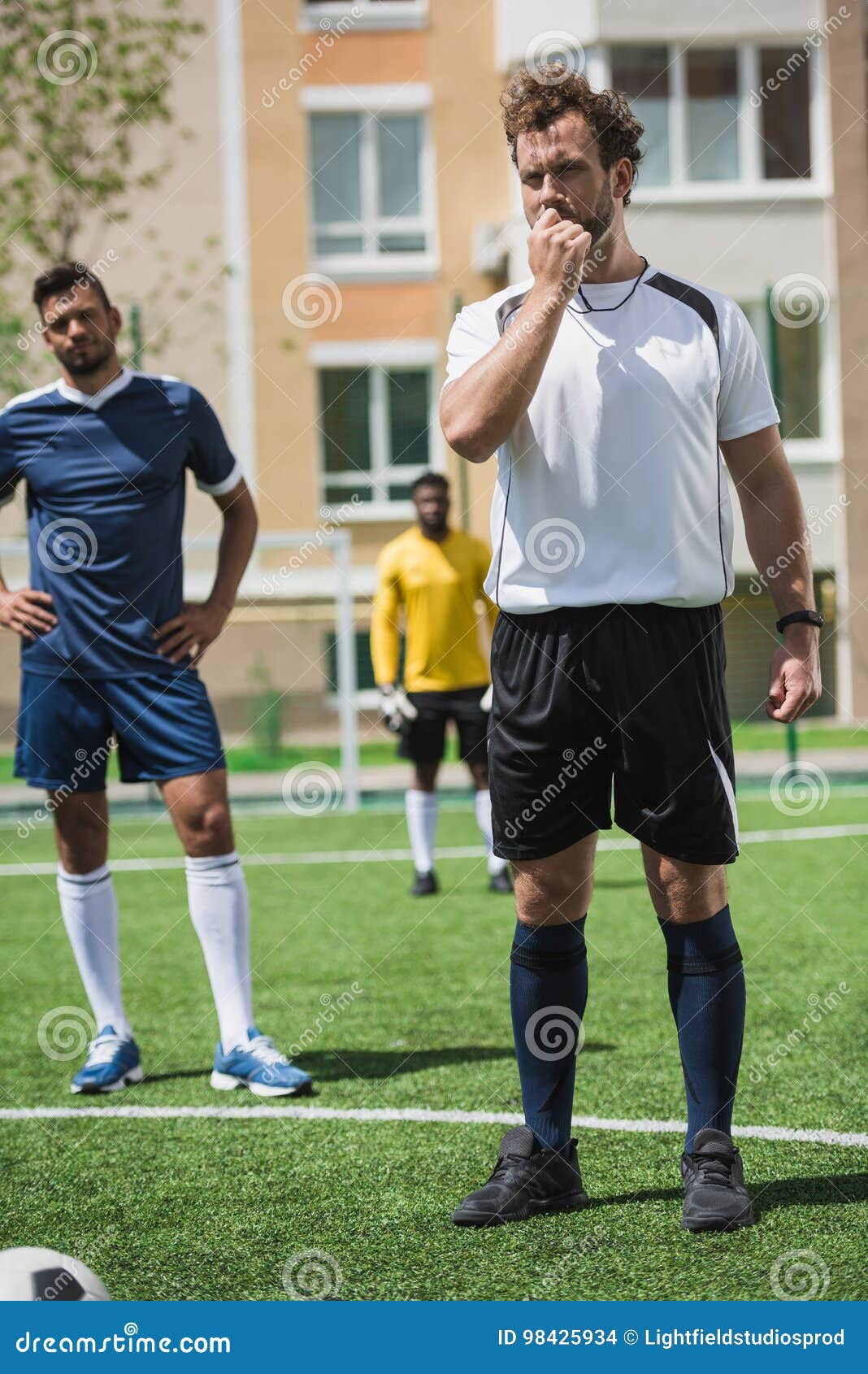 Referee Whistling in Whistle on Soccer Pitch during Game Stock Photo ...