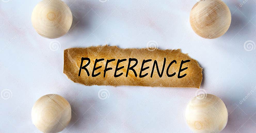 REFERENCE - Word on a Brown Torn Piece of Paper on a Light Background ...