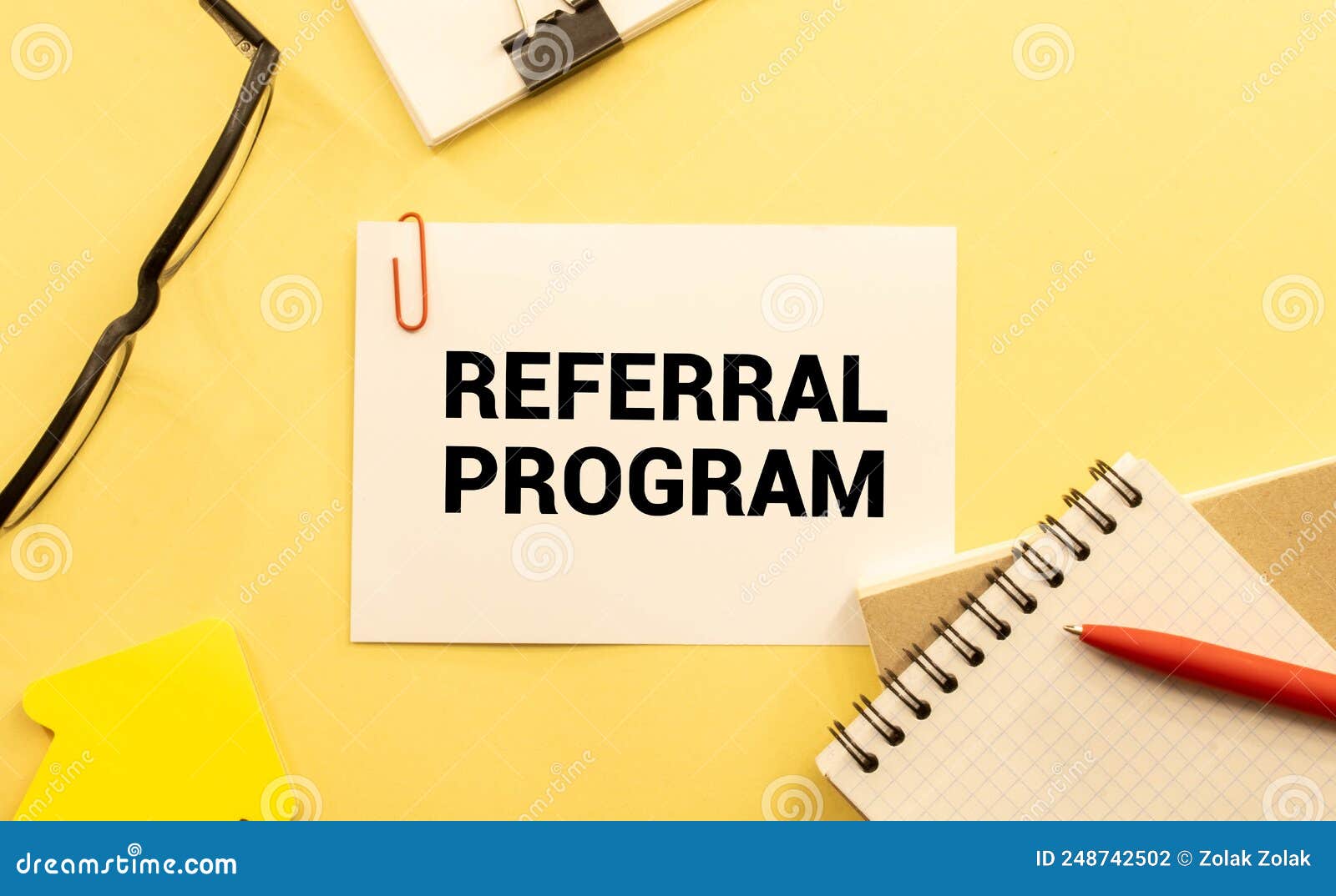Referral Program Open Notepad on Desktop Near White Keyboard and Yellow ...