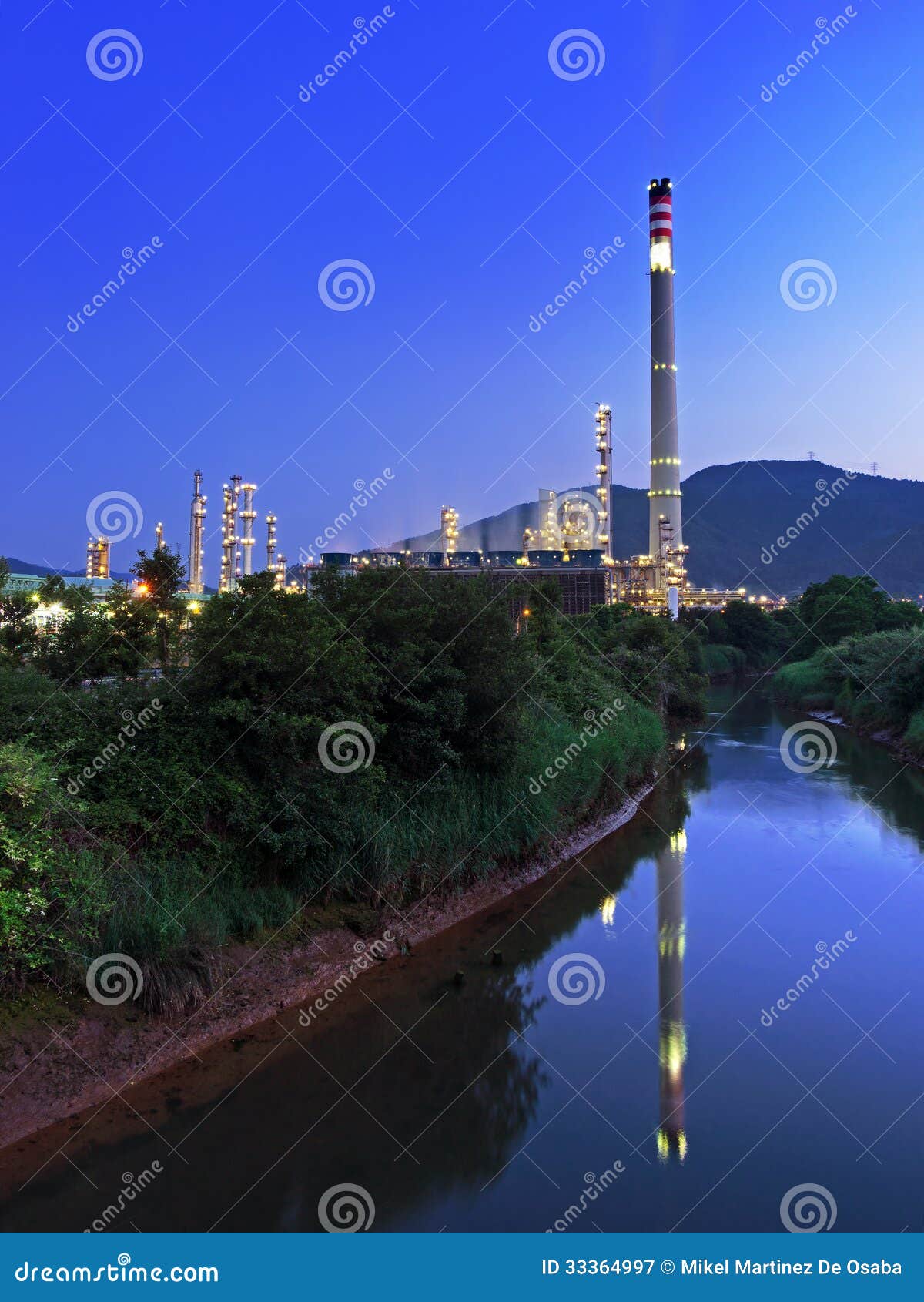 Refinery with Smokestack Near a River Stock Image - Image of plant ...