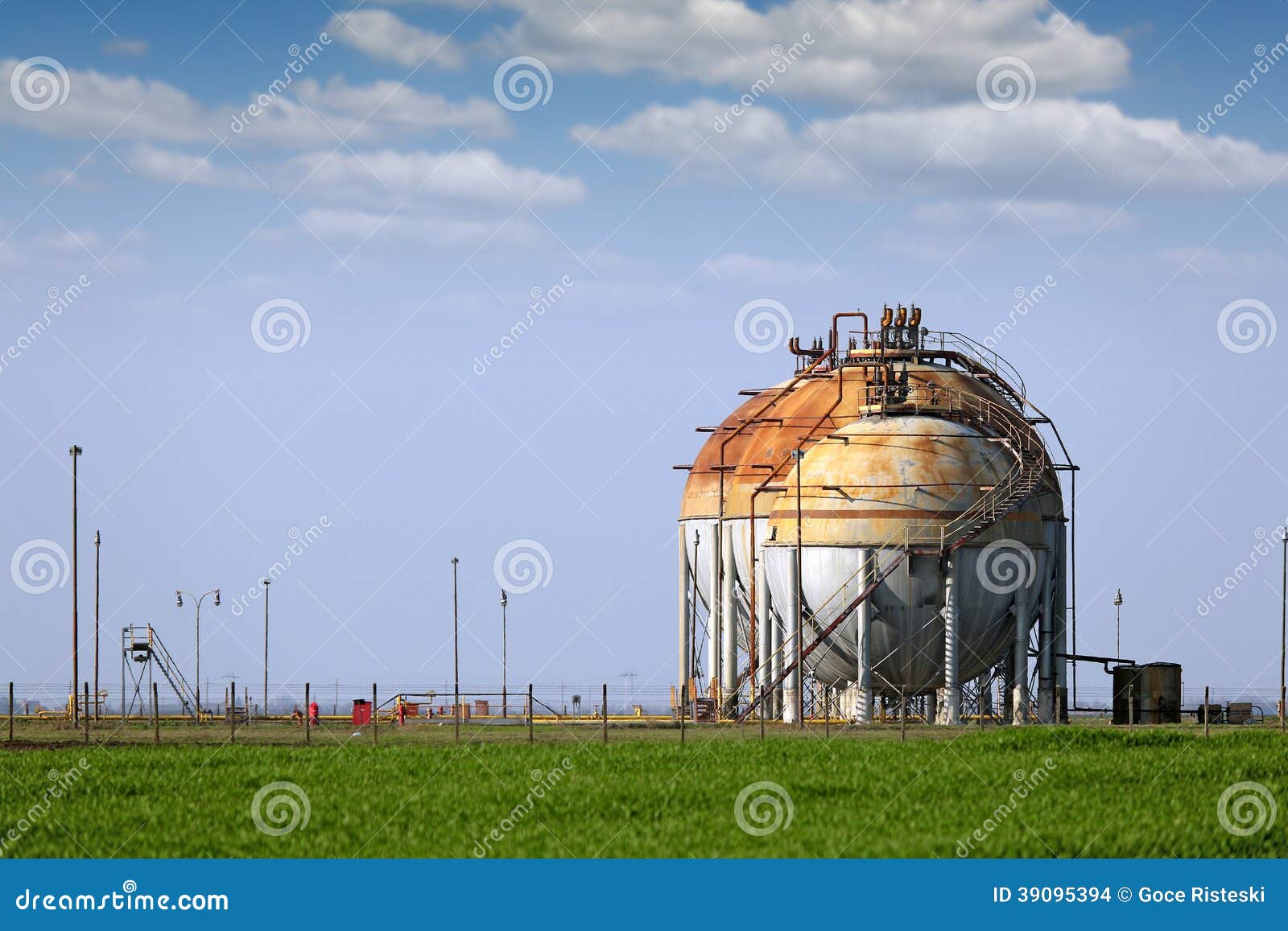 Refinery tanks on field stock photo. Image of distillery - 39095394