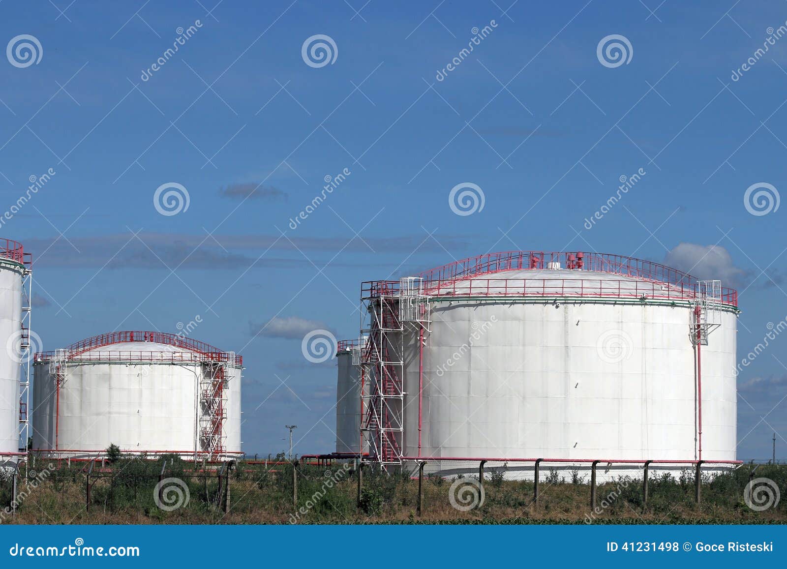 Refinery tanks on field stock photo. Image of pipeline - 41231498