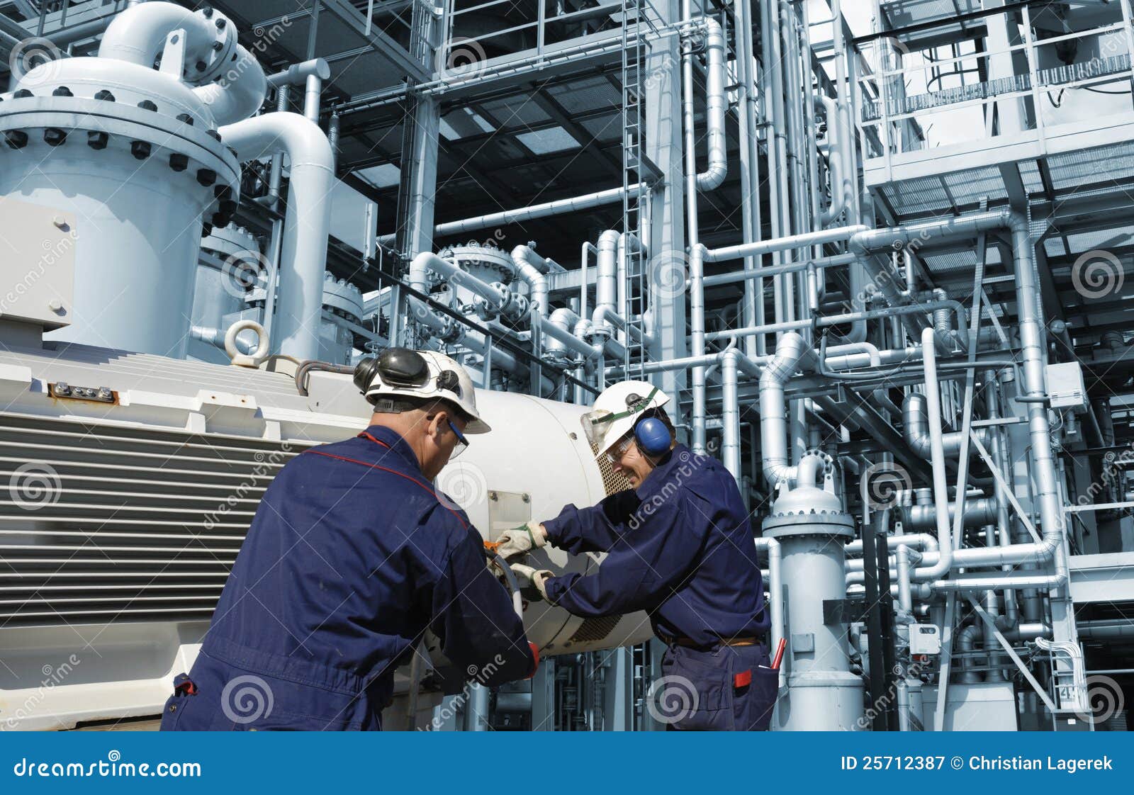 Refinery Workers and Pipelines Stock Image - Image of tanks, distillery ...