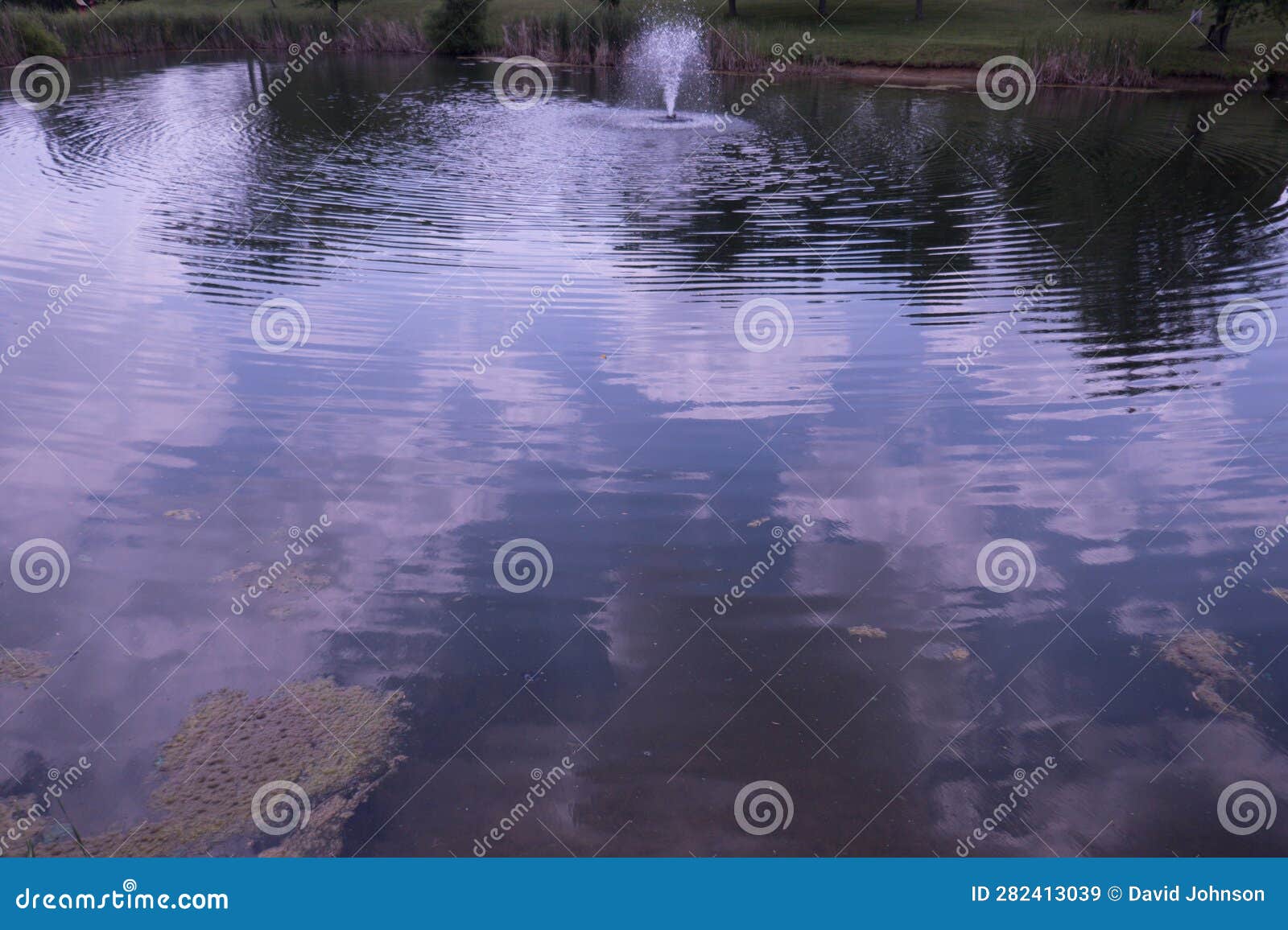 Reflecting Pond with Clouds and Water Fountain Stock Image - Image of ...