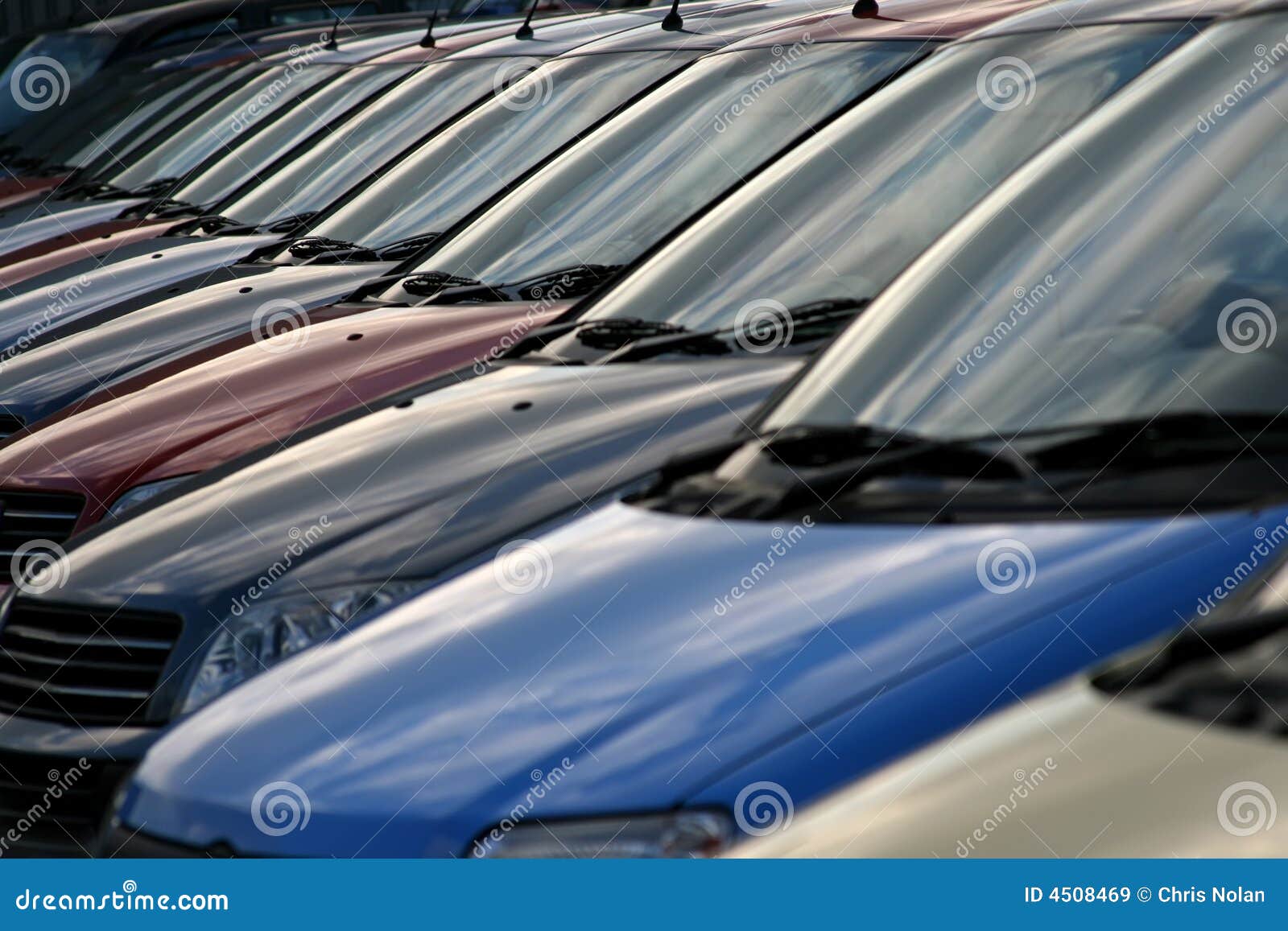 Reflecting Windscreens from a Row of Cars Stock Image - Image of ...