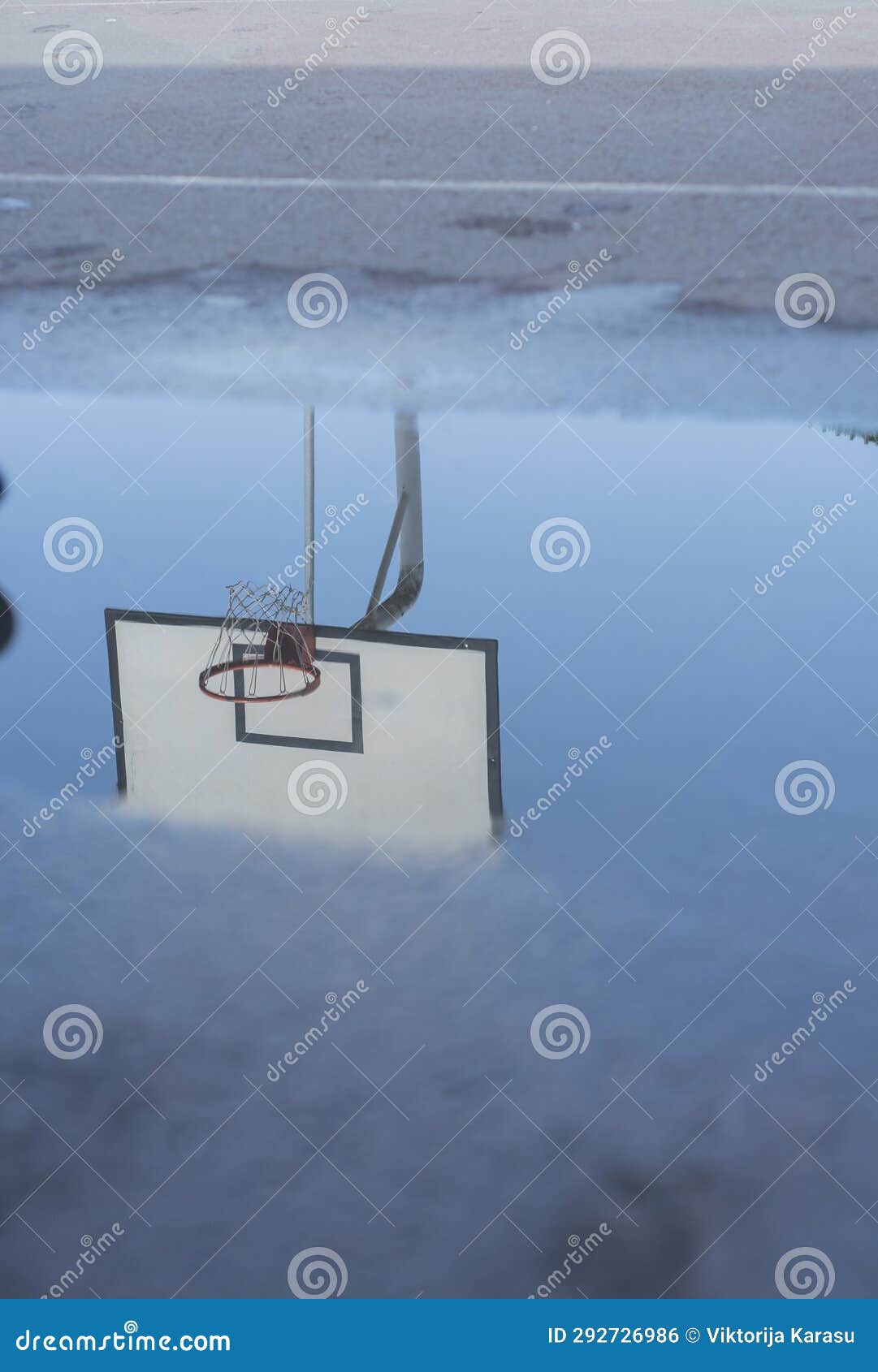 Reflection of a Basketball Ring in a Puddle after the Rain Stock Photo ...