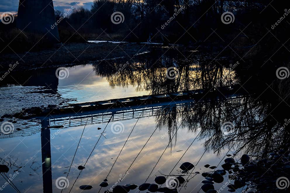 Reflection of a Bridge in the River Stock Photo - Image of bridge ...