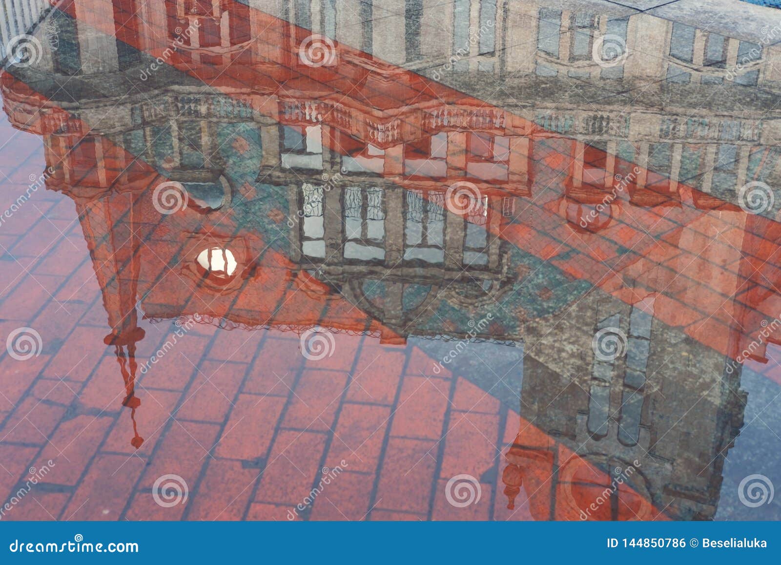 Reflection of the Building on Puddle Stock Photo - Image of building ...
