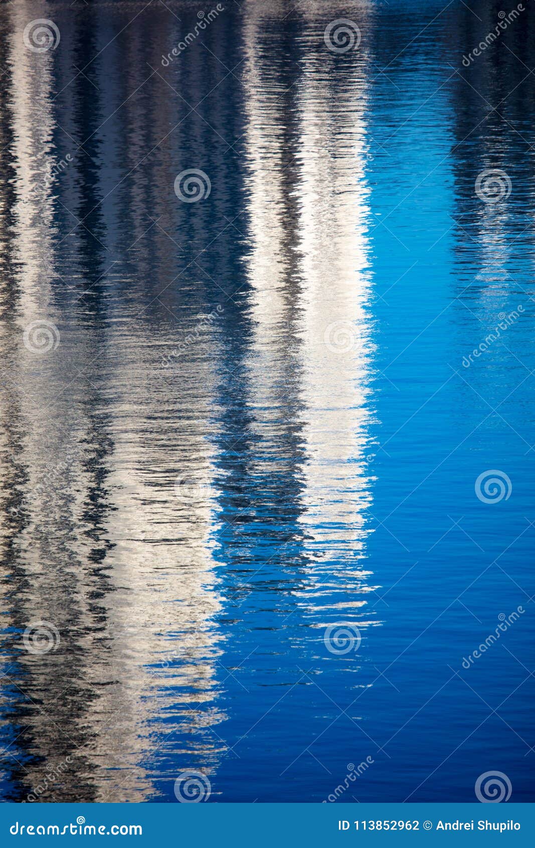 Reflection of a Building on the Smooth Surface of Water As a Background ...