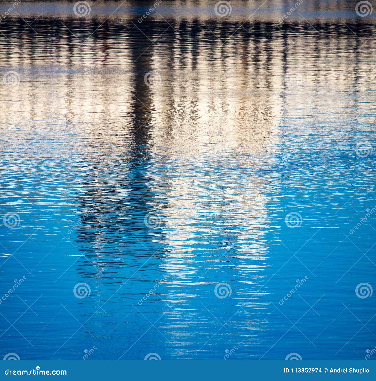 Reflection of a Building on the Smooth Surface of Water As a Background ...