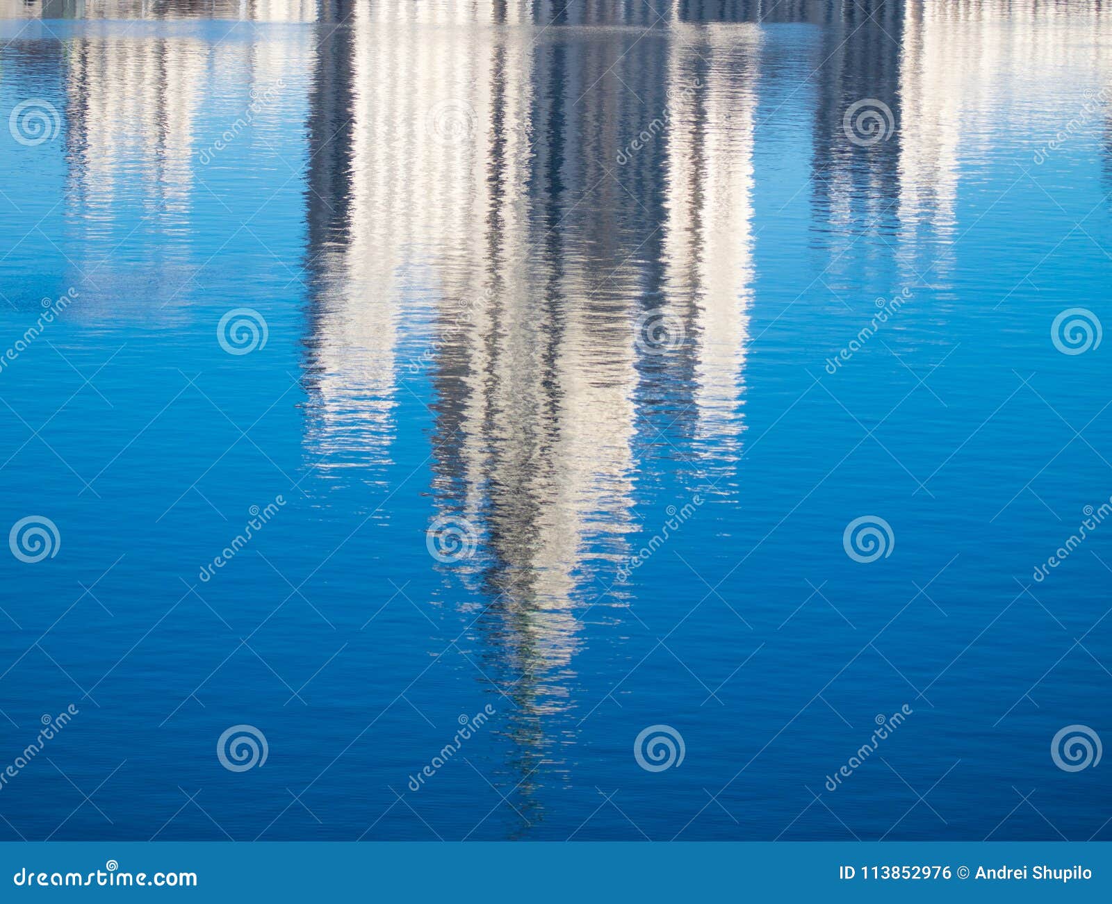 Reflection Of A Building On The Smooth Surface Of Water As A Background ...