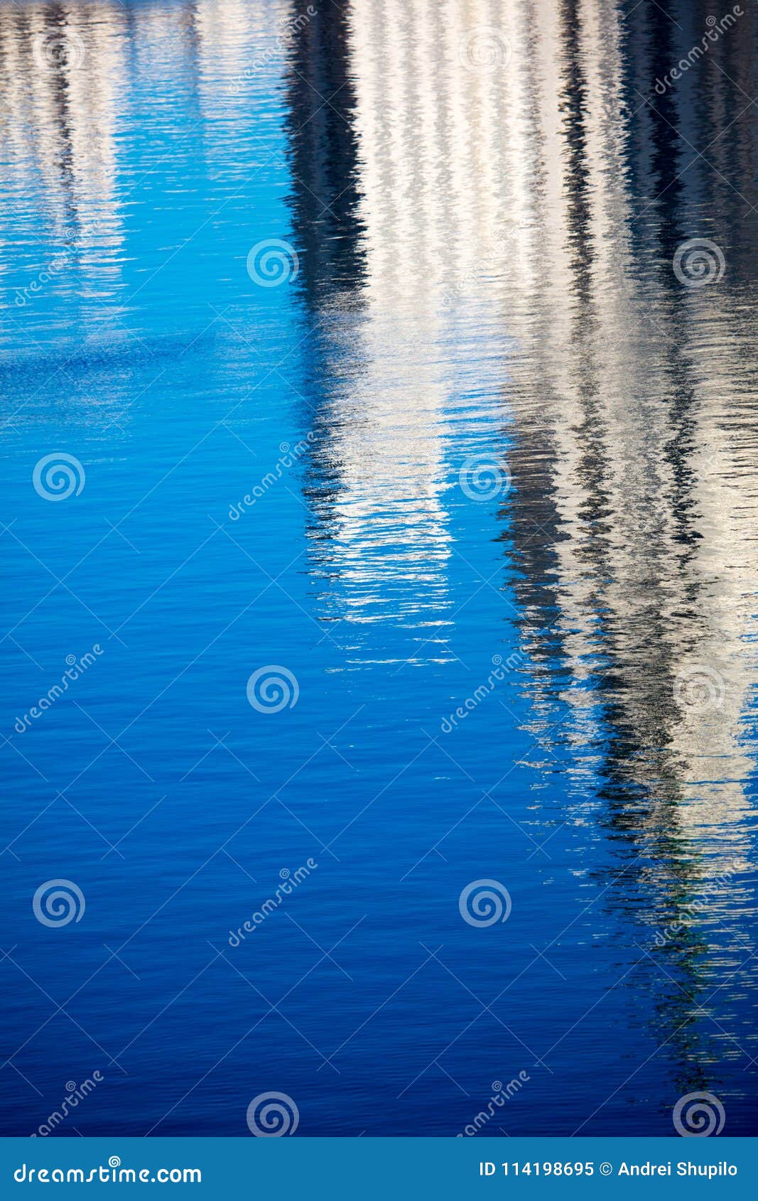 Reflection of a Building on the Smooth Surface of Water As a Background ...