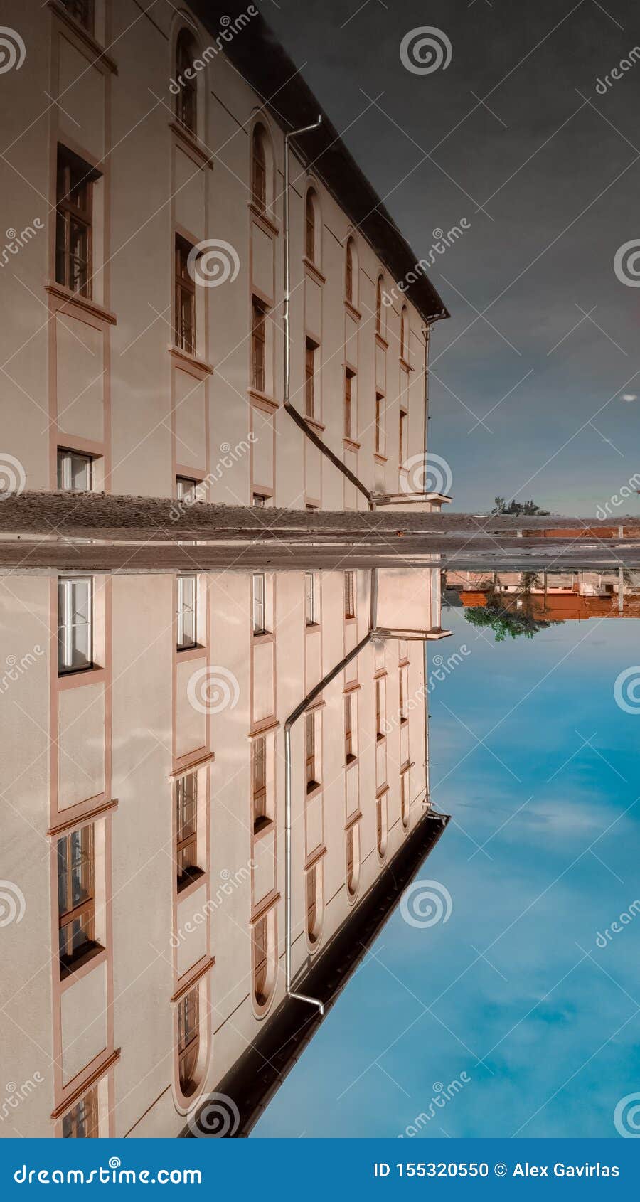 Reflection of Building in a Water Puddle. Clear Reverted Mirror Effect ...