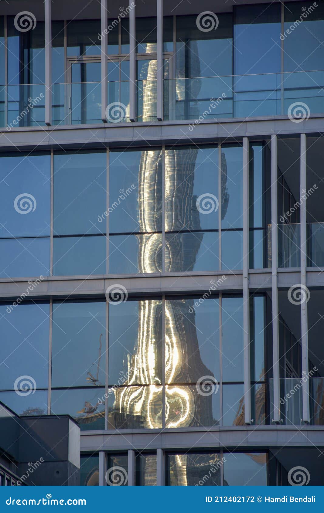 The Reflection of the Burj Khalifa on a Building Glass Stock Photo ...