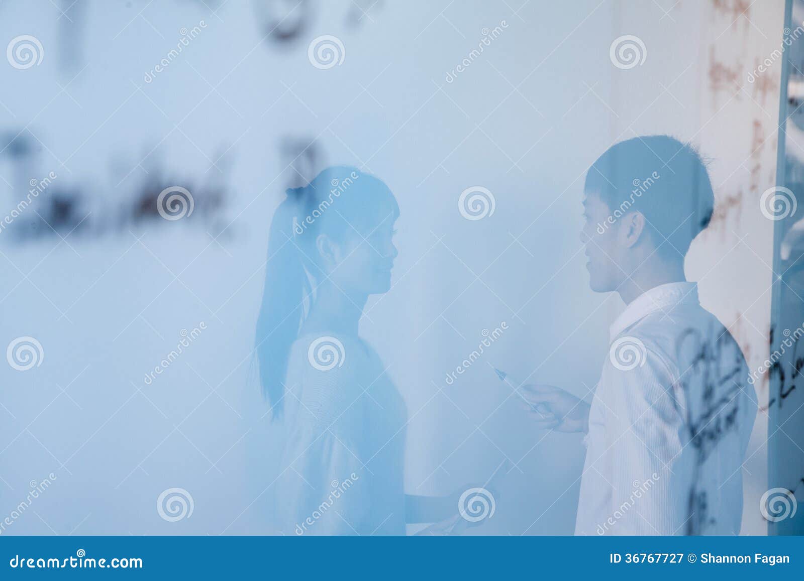 Reflection of Businessman and Businesswoman Talking in the Office Stock ...