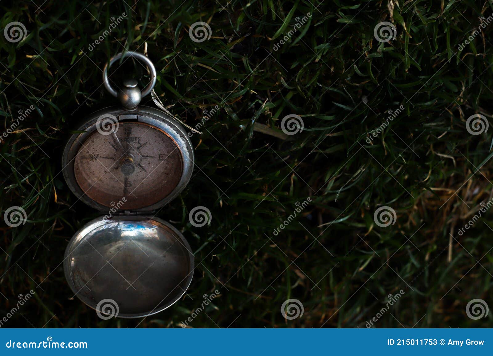 A compass points the way. stock image. Image of reflection - 215011753