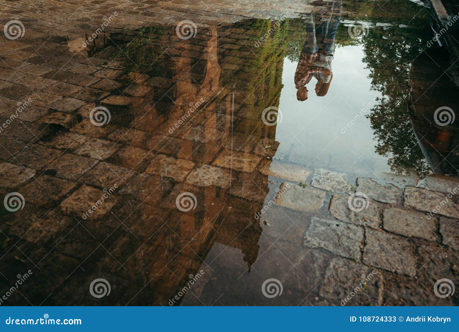 The Reflection of the Charming Hugging Couple in the Puddle. Poland ...