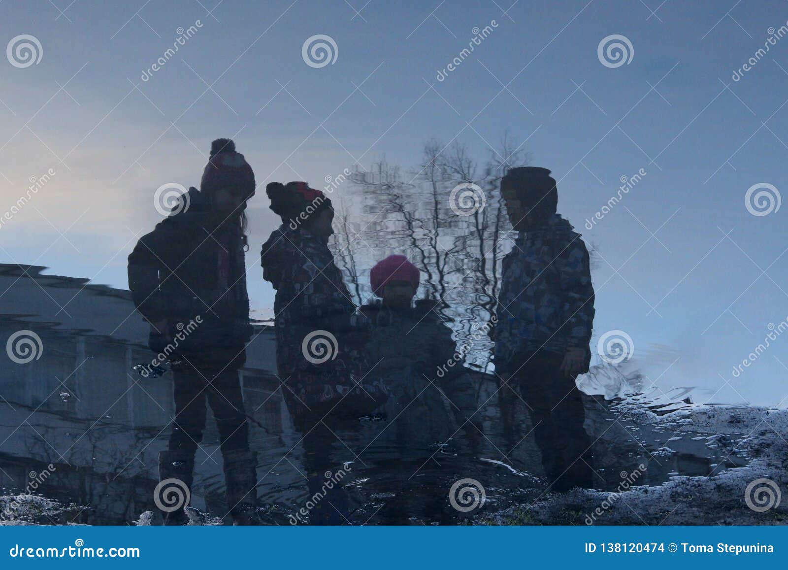 Reflection of Children in a Puddle. Stock Photo - Image of puddle ...