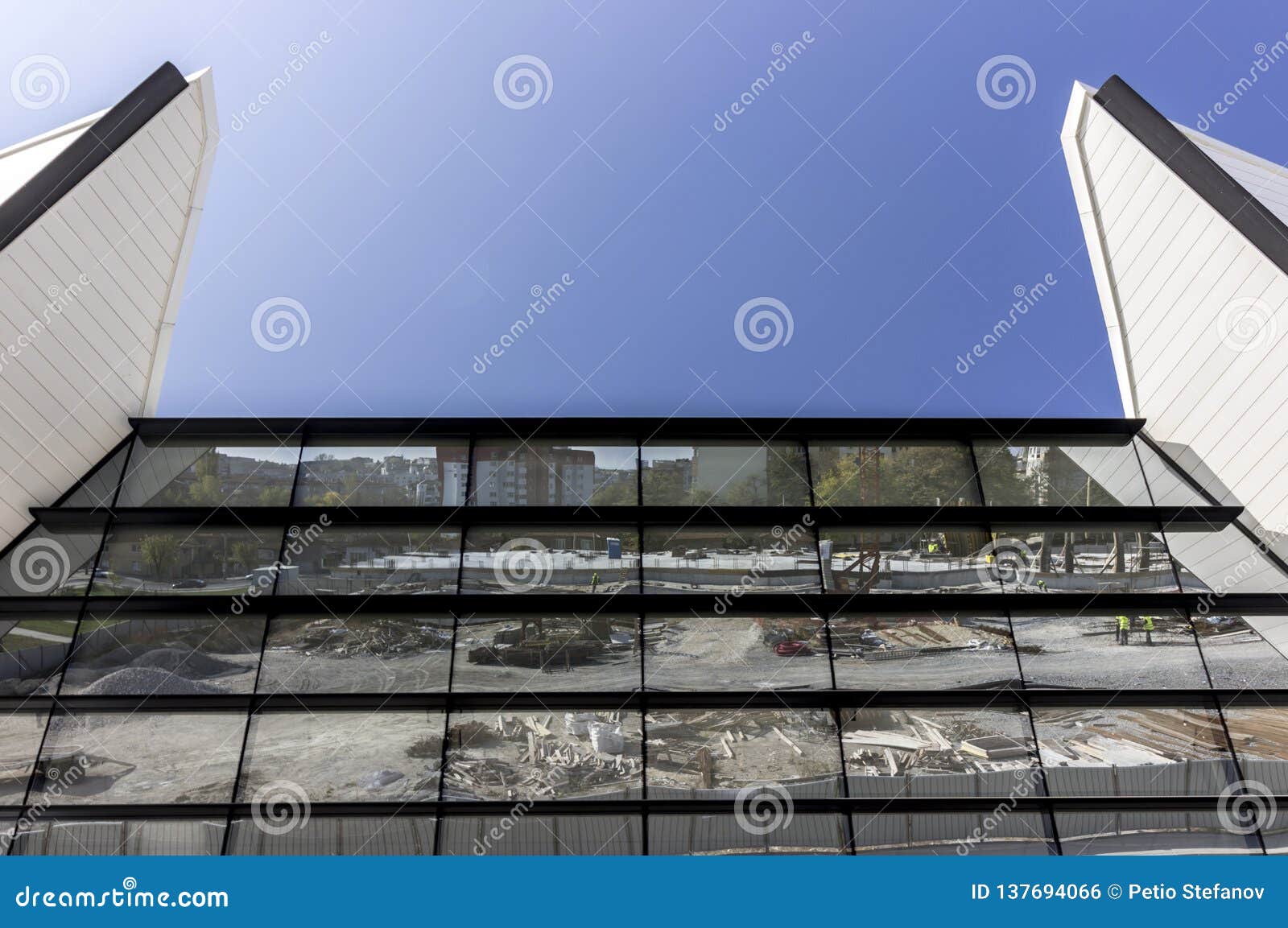 A Reflection of the Construction of a New Building Stock Photo - Image ...
