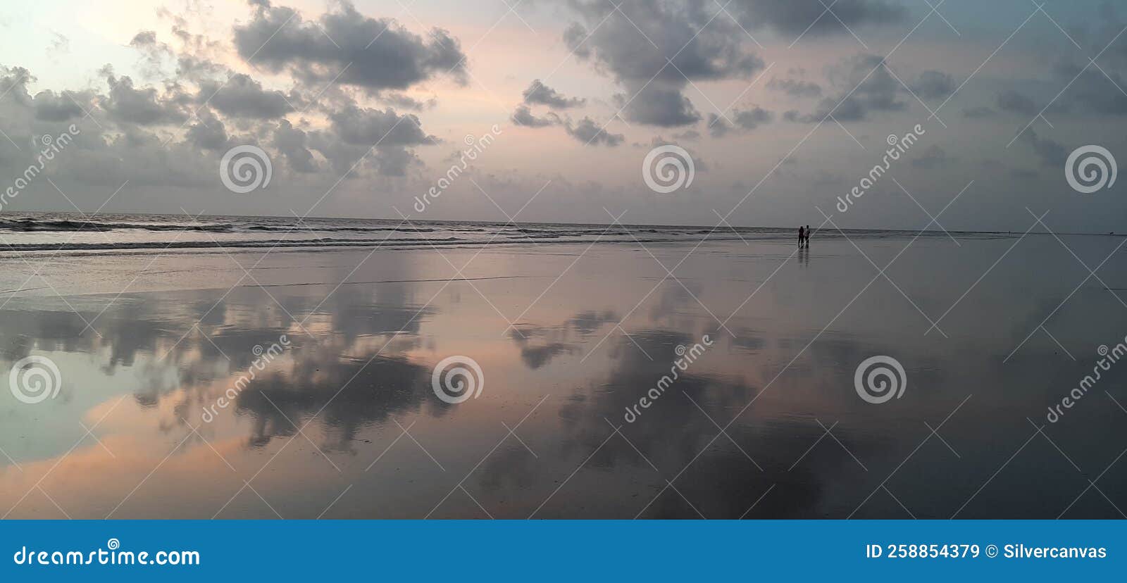 A Reflection of the Dynamic Sky on the Beach. a Sunset Stock Image ...