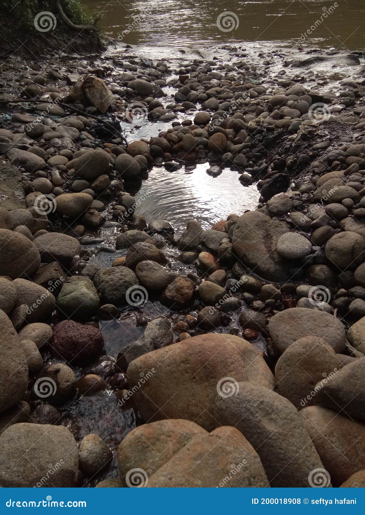 Reflection of the Evening Light between the River Rocks Stock Photo ...