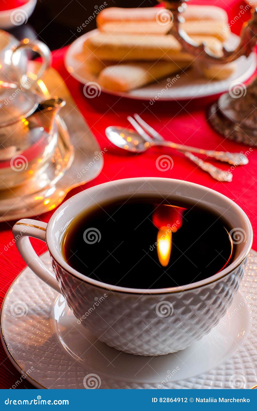 The Reflection of the Flame in a Cup of Tea Stock Photo - Image of ...