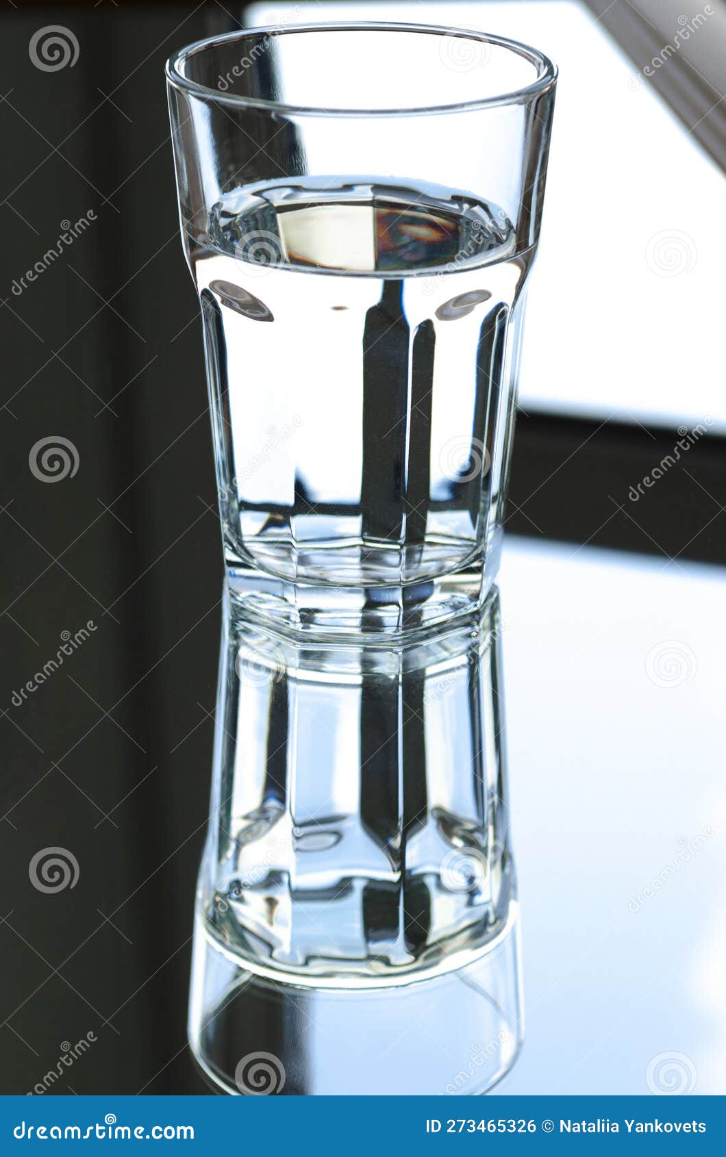 Reflection of a Glass of Spring Water in the Mirror Stock Photo - Image ...