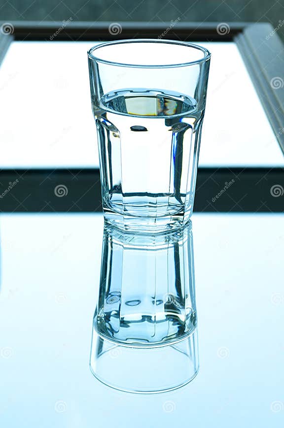 Reflection of a Glass of Spring Water in the Mirror Stock Image - Image ...