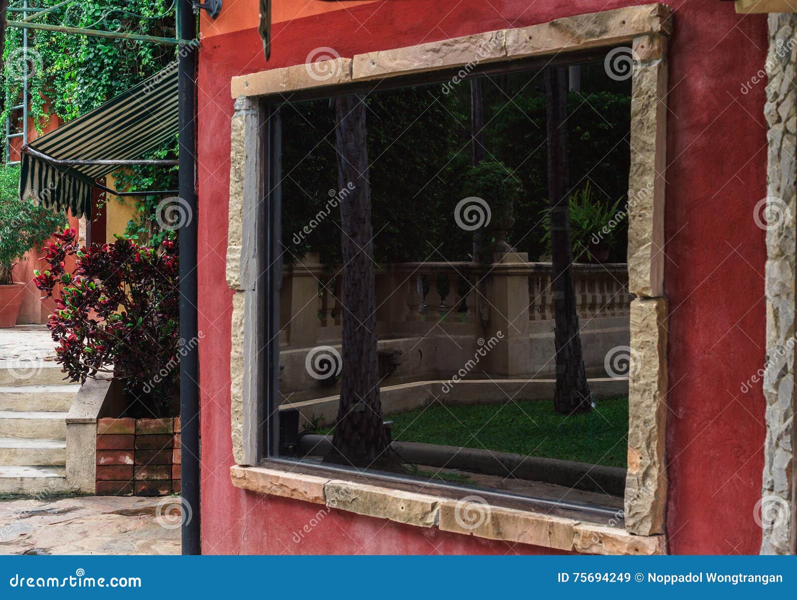Reflection in Glass Window on Red Wall Stock Image - Image of beautiful ...
