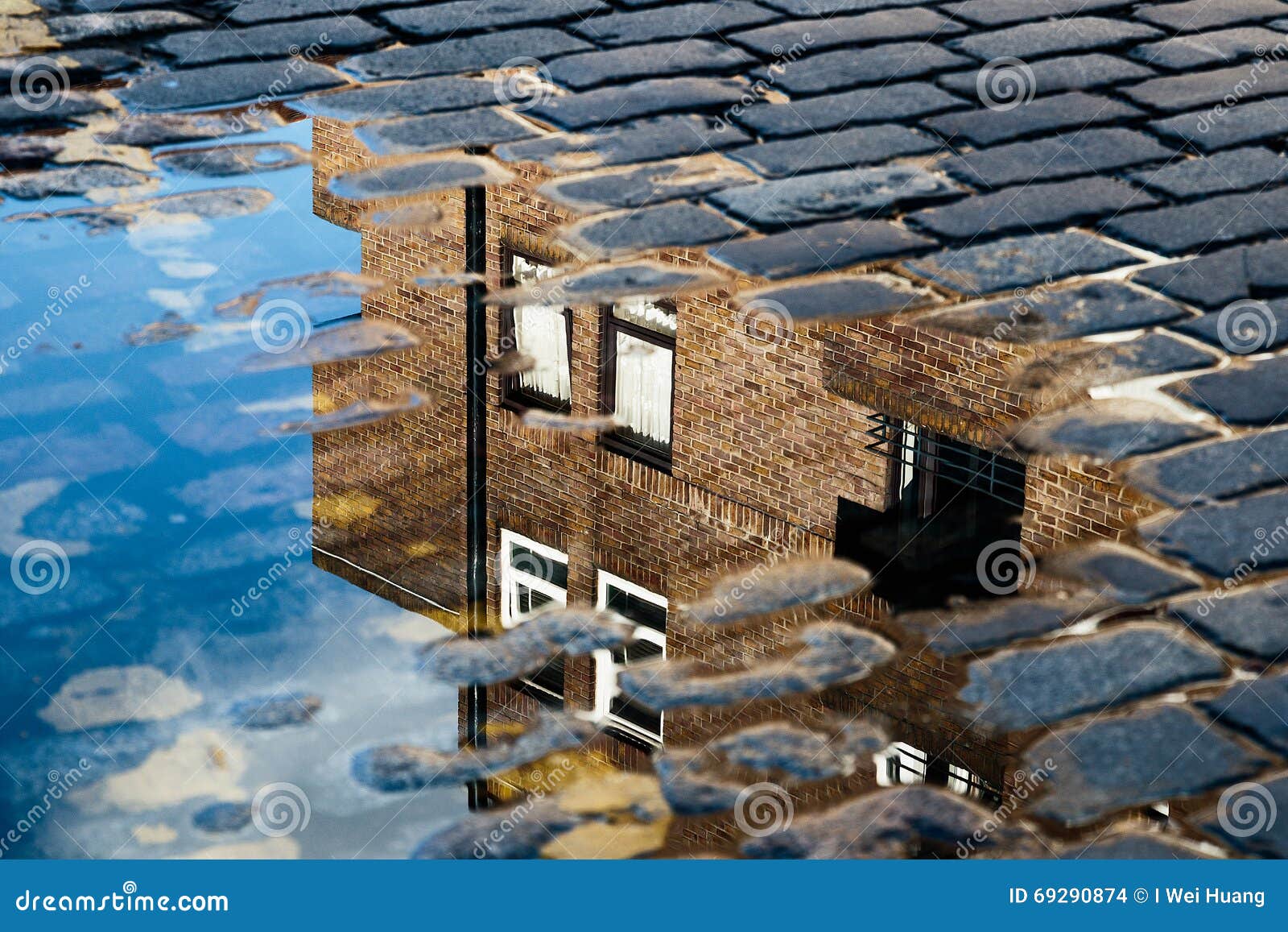 Reflection of House in Puddle Stock Photo - Image of alley, mirroring ...