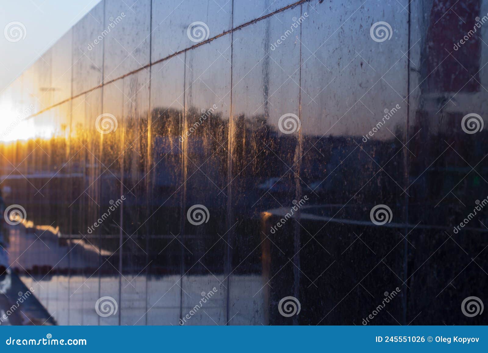 Reflection of Light on the Cladding. the Sunset Sun is Reflected in the ...