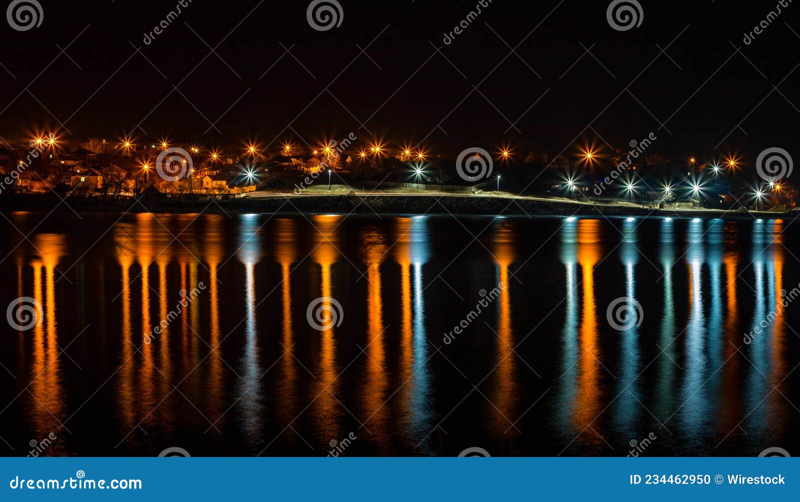 Reflection of Lights on the Surface of a Calm Coast at Nighttime Stock ...