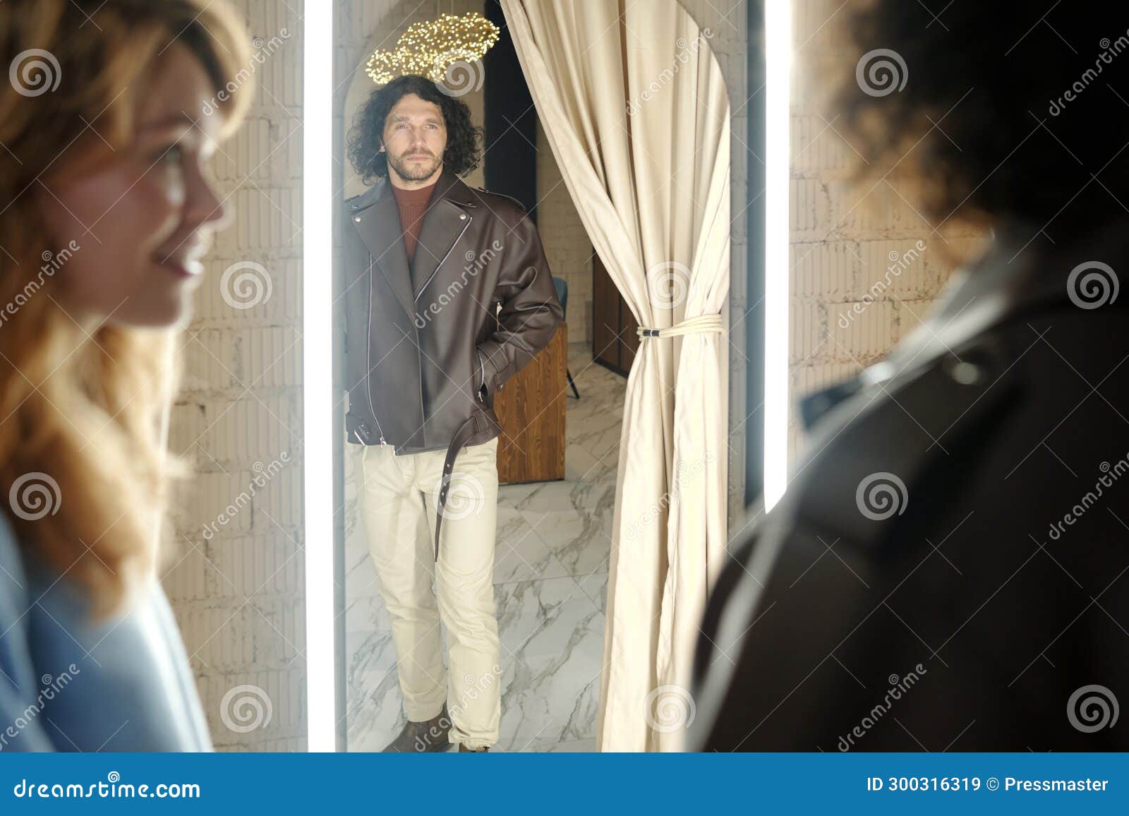 Reflection in Mirror of Young Man Trying on Stylish Leather Jacket ...