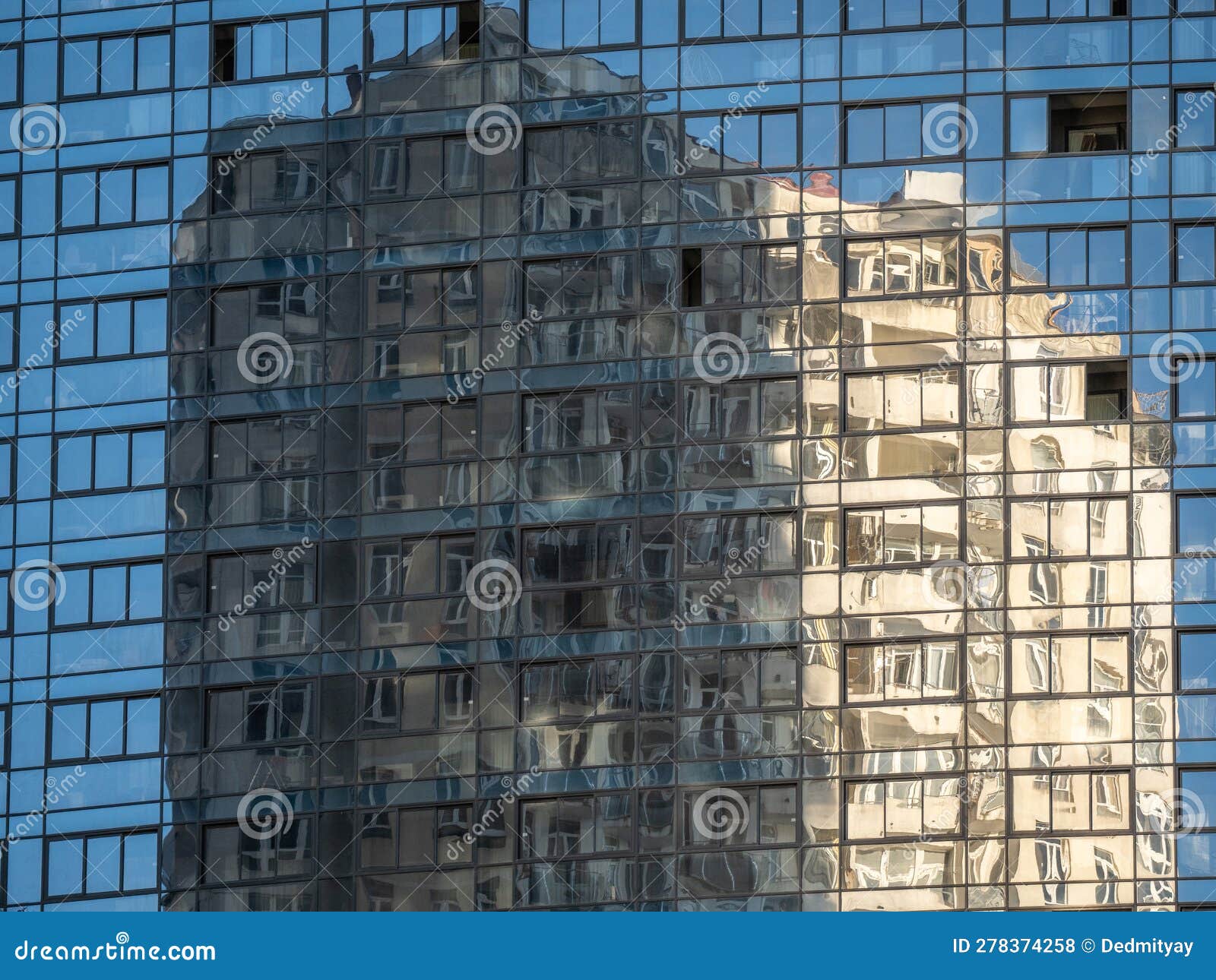 Reflection of Modern Large Building in Glass Surface of Another ...
