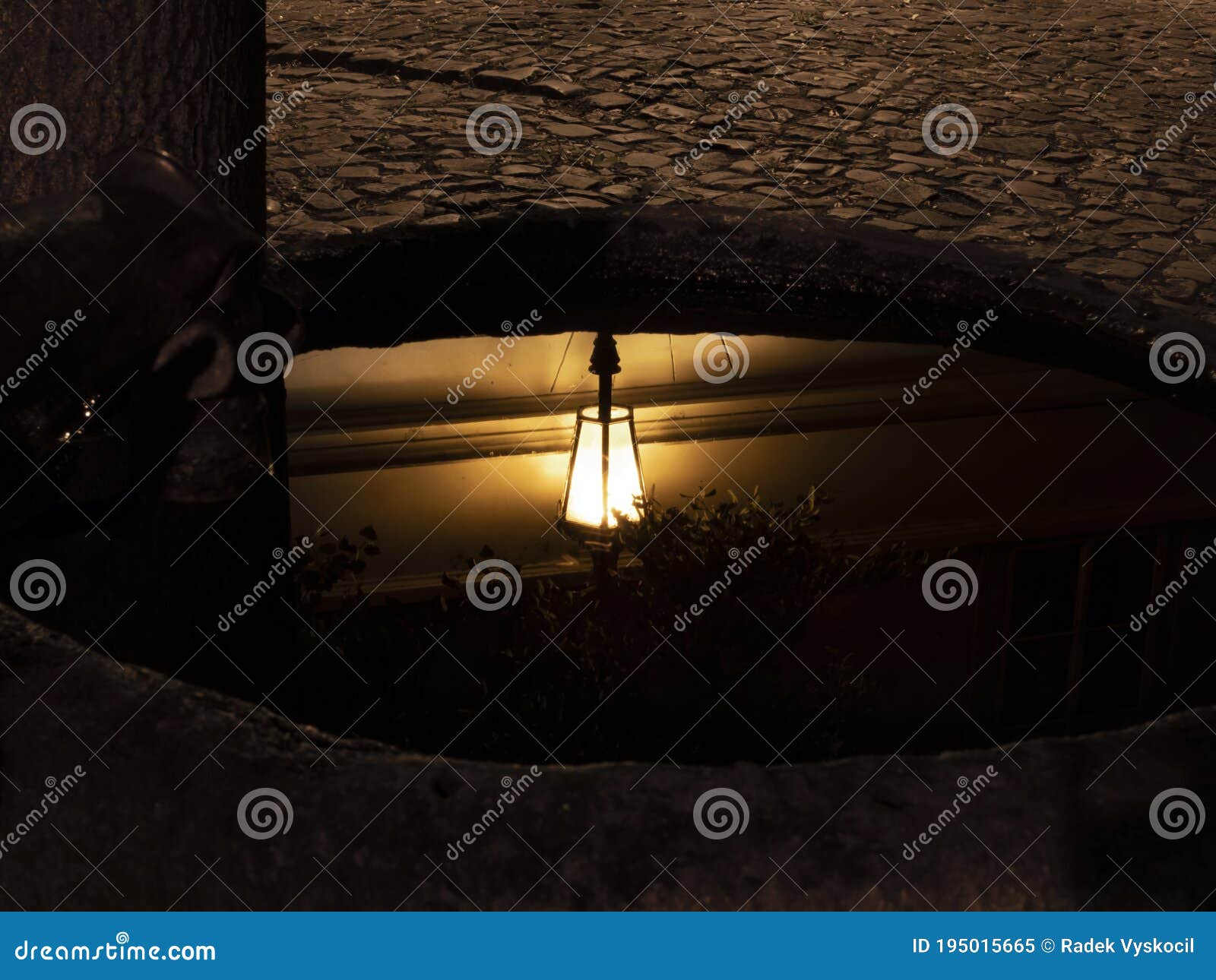 Reflection of an Old Lamp on the Water Surface at Night Stock Image ...