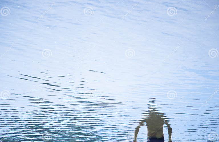 Reflection of One Man Standing in Water Stock Photo - Image of enter ...