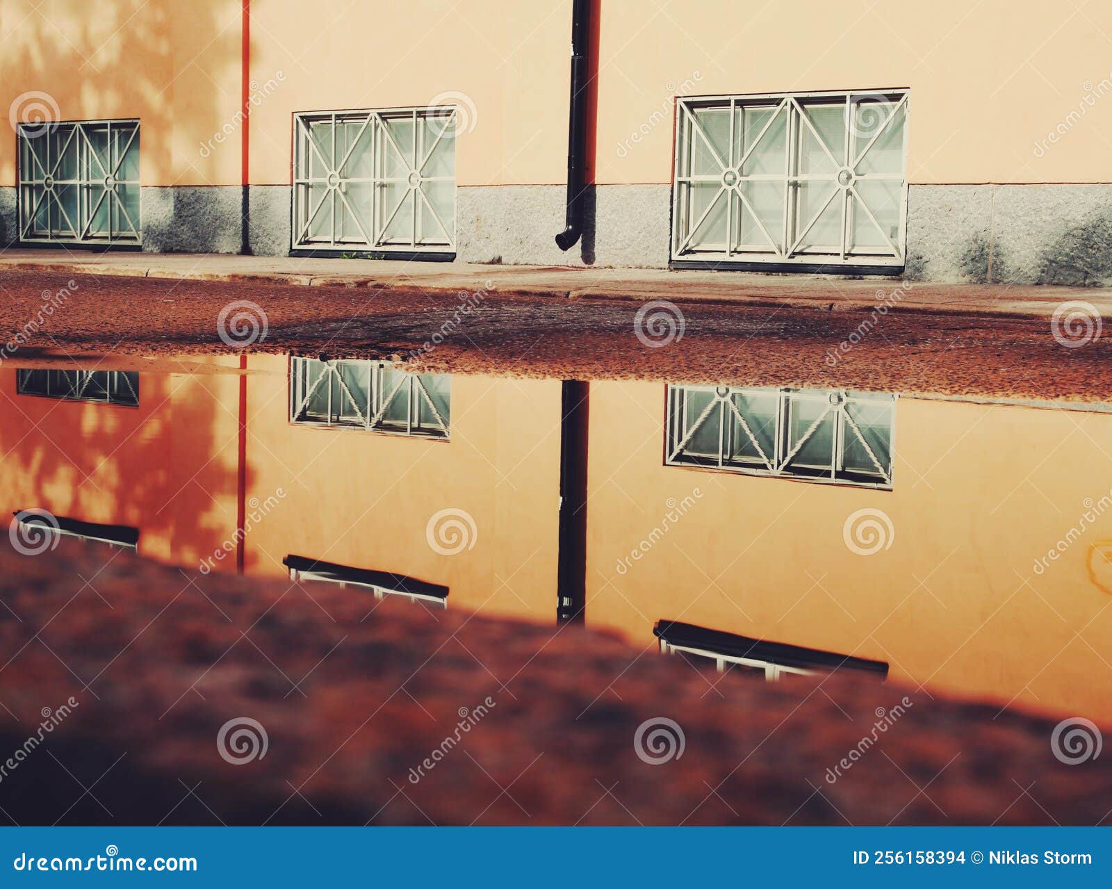 Reflection in a Puddle on City Street Stock Photo - Image of iron ...